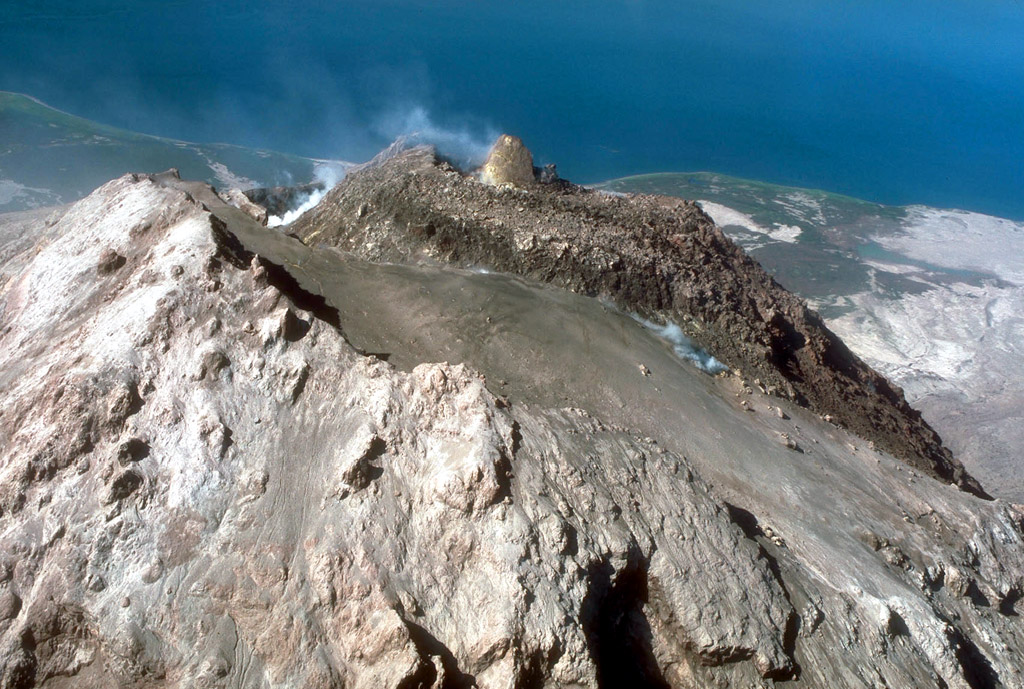 he summit lava dome complex at Augustine Volcano. Steam rises from the ...
