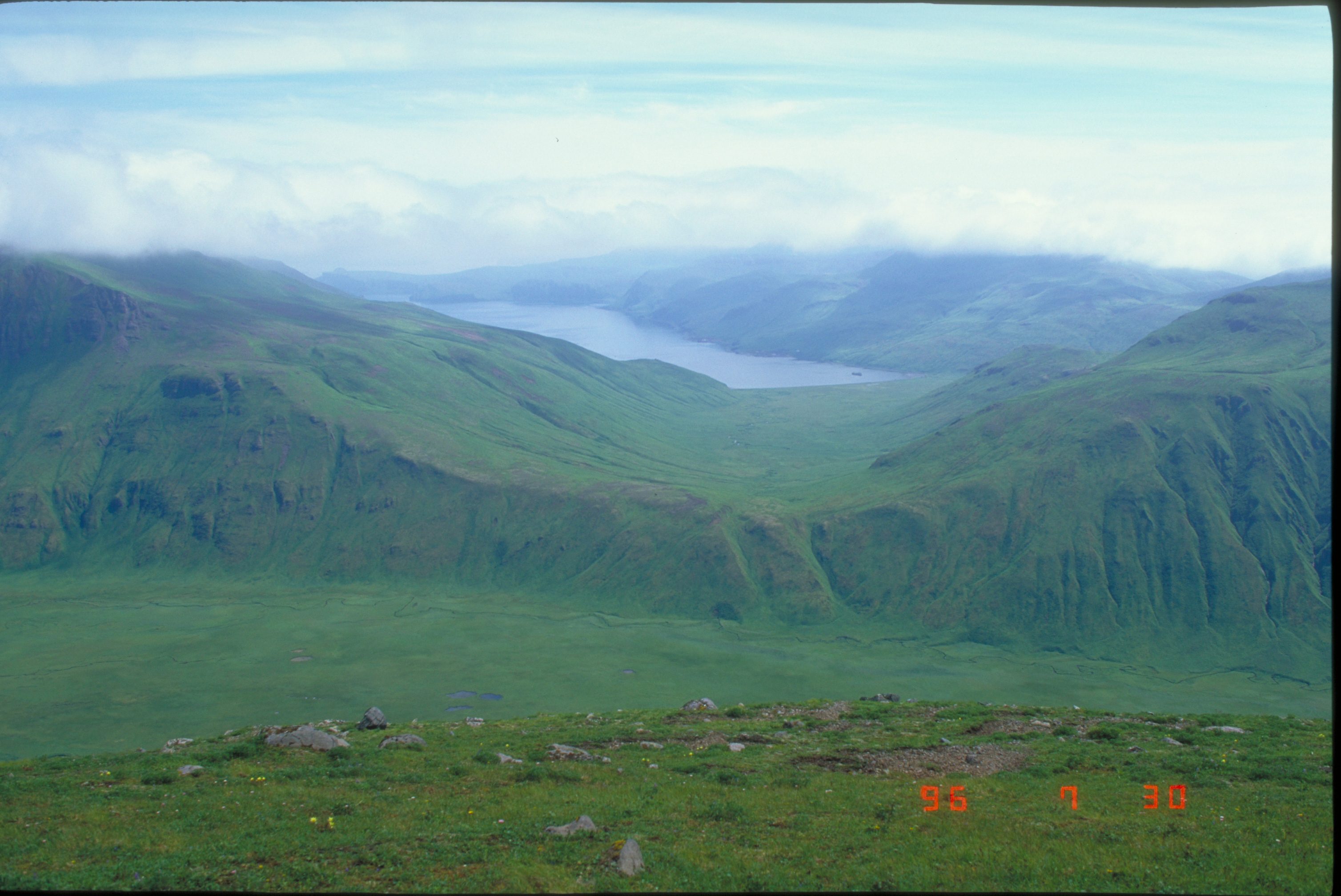 View east from summit of peak 1917T on Akutan Volcano across the middle ...