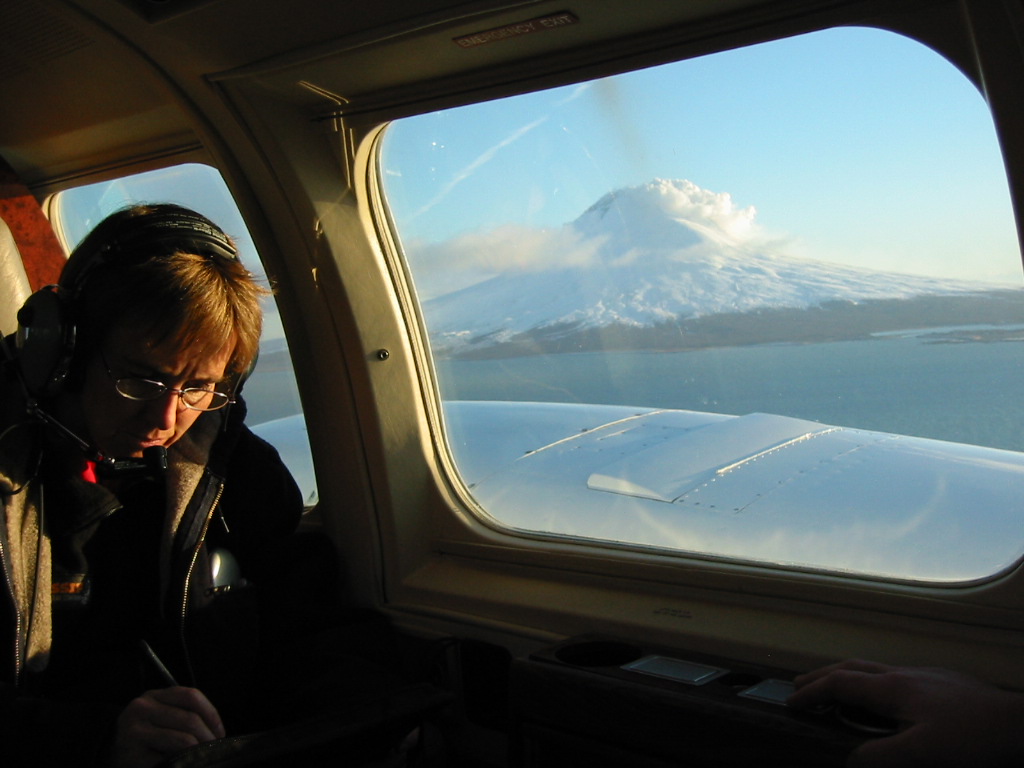 AVO gas measurement flight to Augustine Volcano. Scientist runs a ...