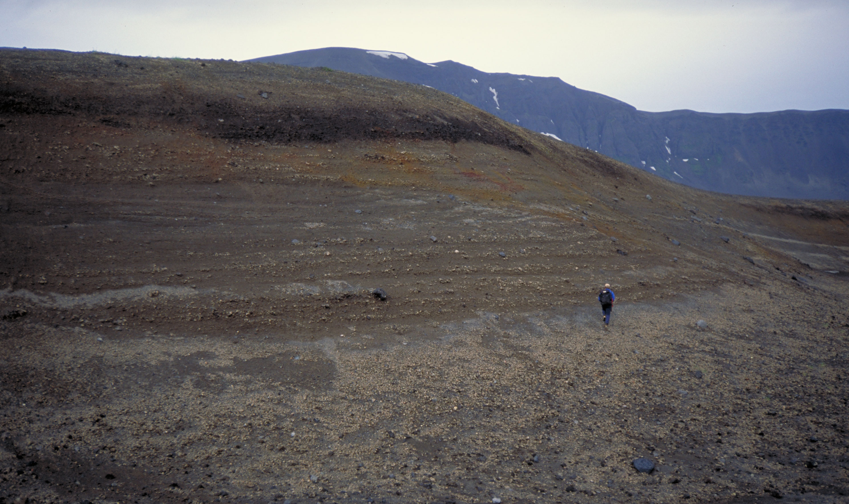 Geologist in pyroclastic flow / surge canyon, young Half Cone depsosits ...