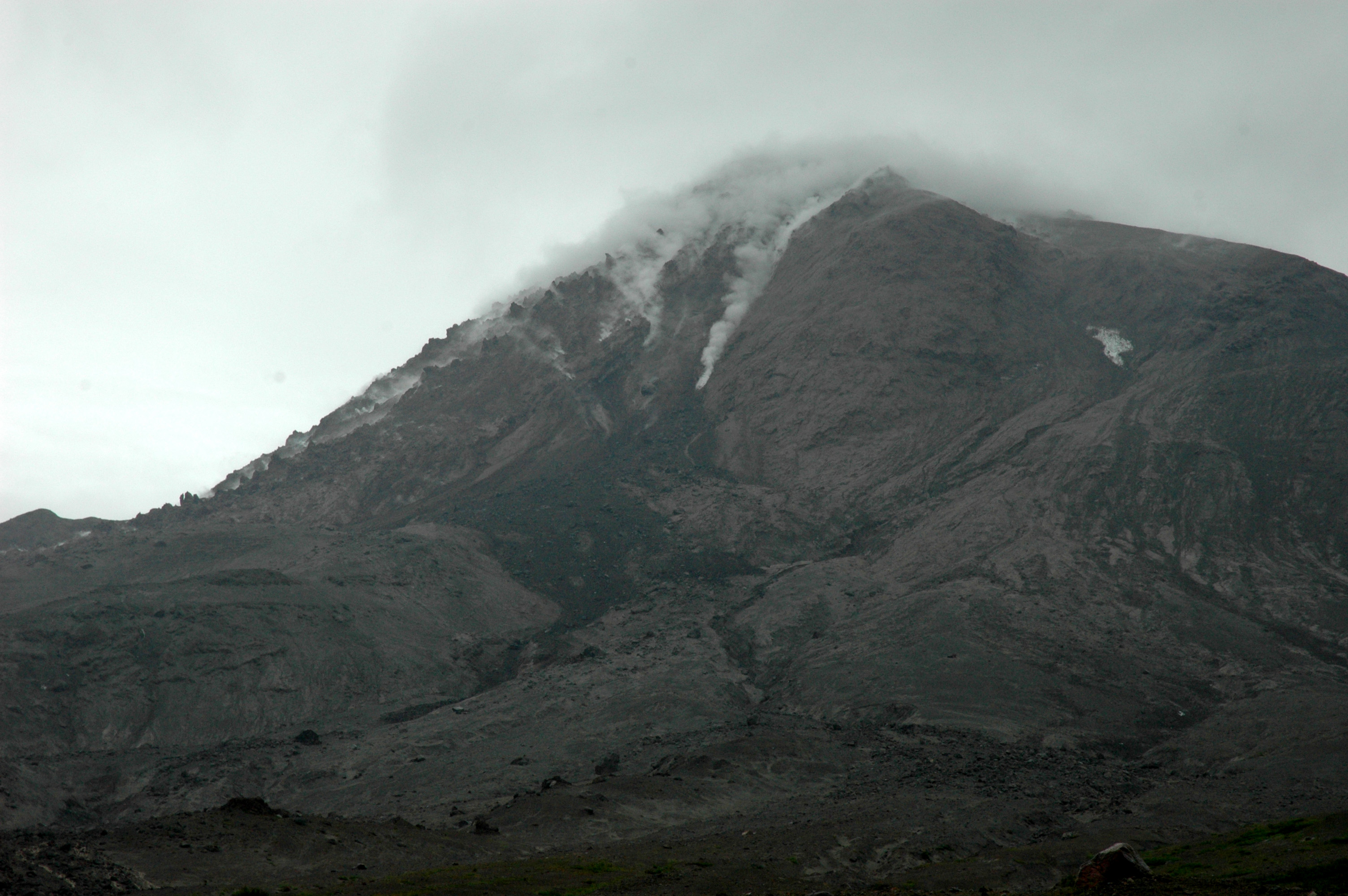 Upper northwest flank of Augustine volcano showing the source chute of ...
