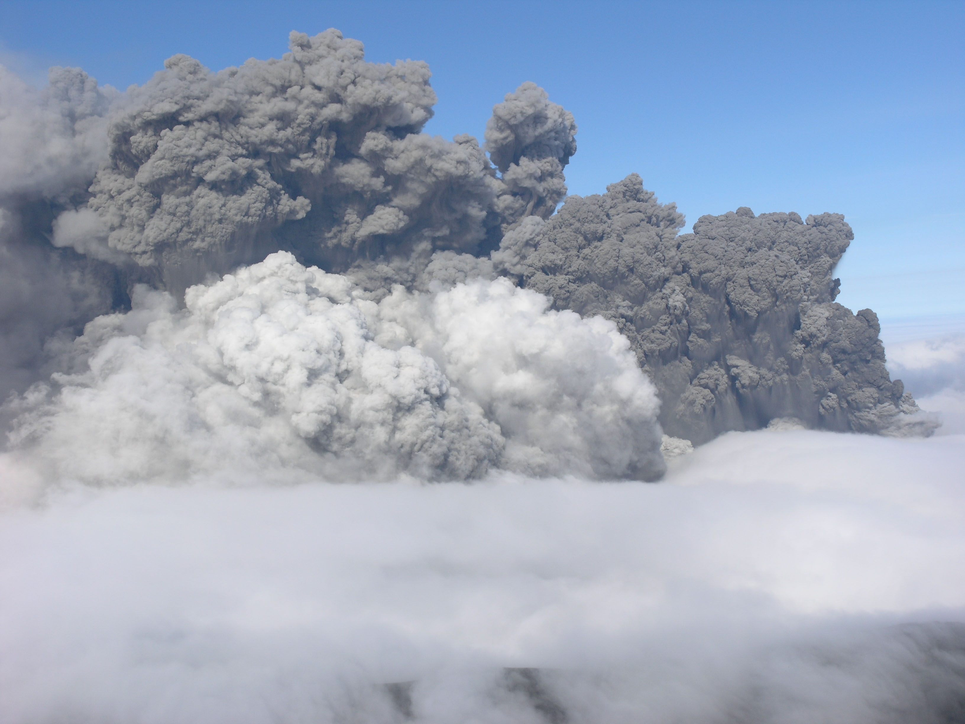 Eruption of Okmok volcano, August 2, 2009. Flying above the eastern ...
