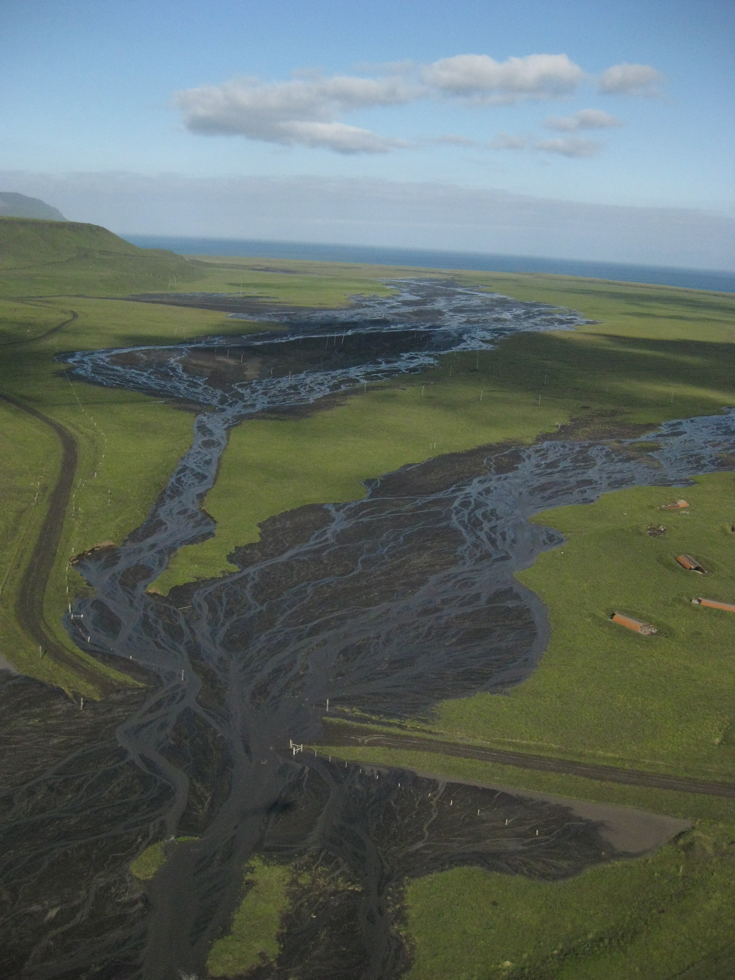 Photo showing several lahars that pond in a low, swampy region just ...