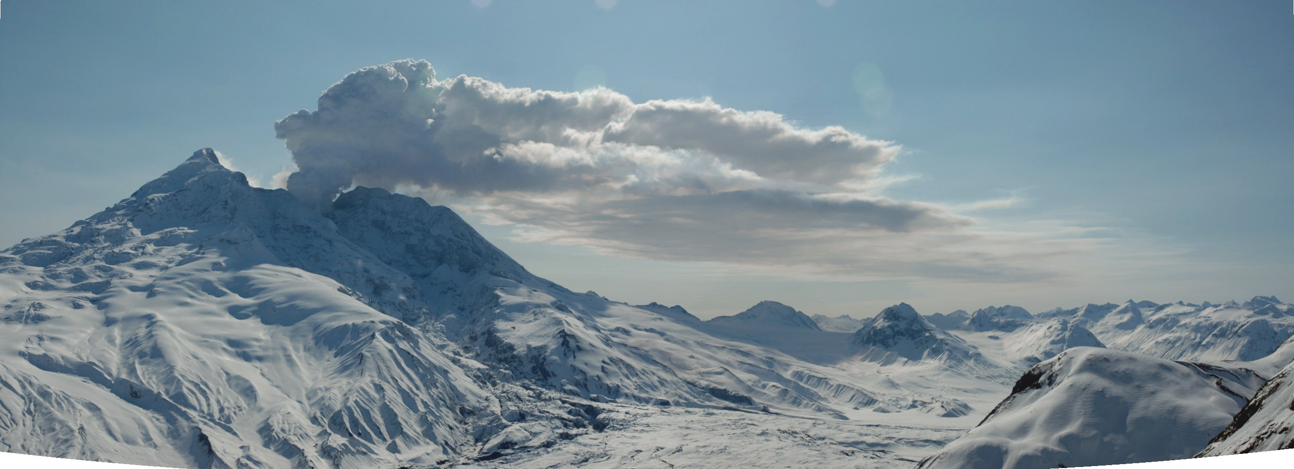 View west of the extensive gas and steam plume from Redoubt Volcano.