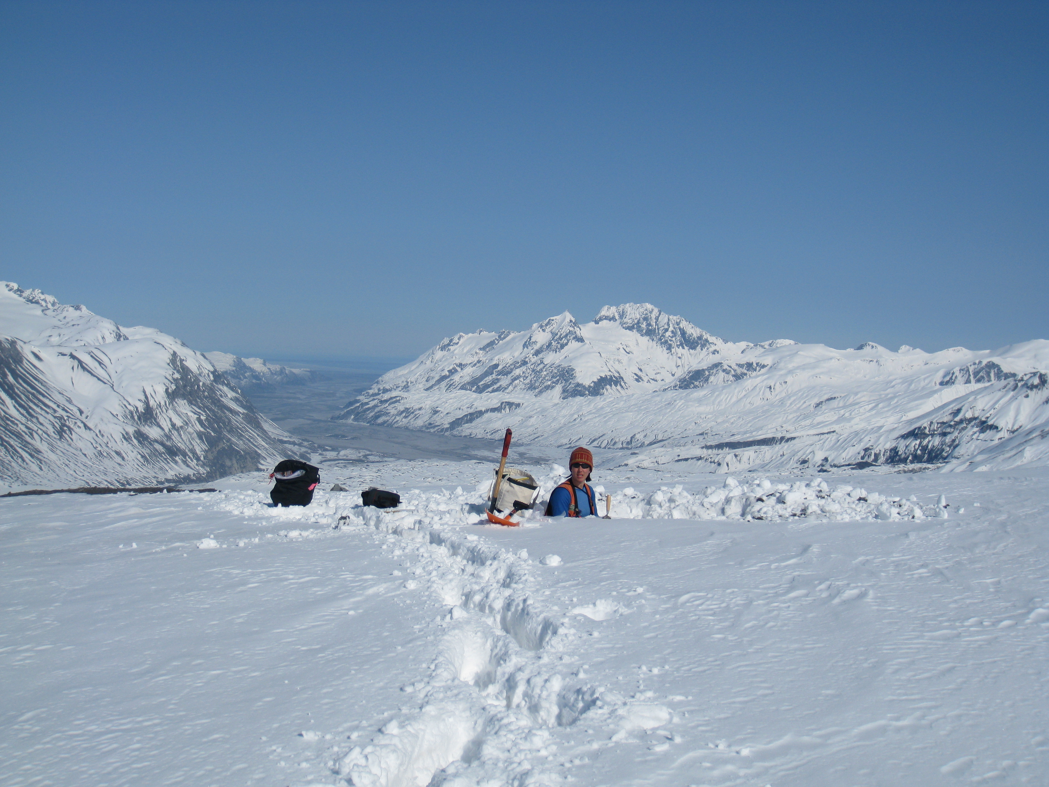 USGS Geologist, Kristi Wallace, digging a snow pit to sample ash fall ...