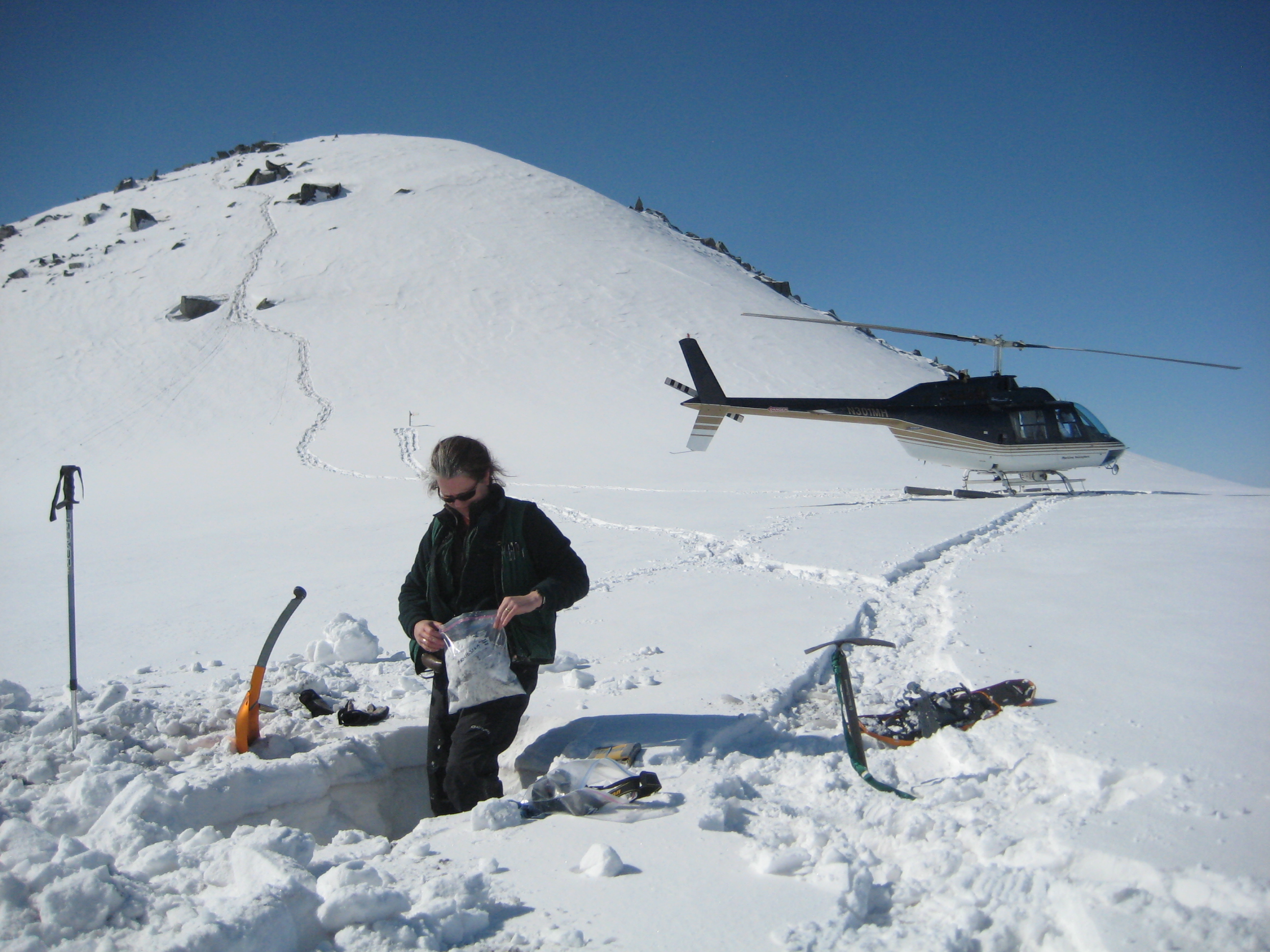 Geologist Kate Bull documents and collects layers of ash on the west ...