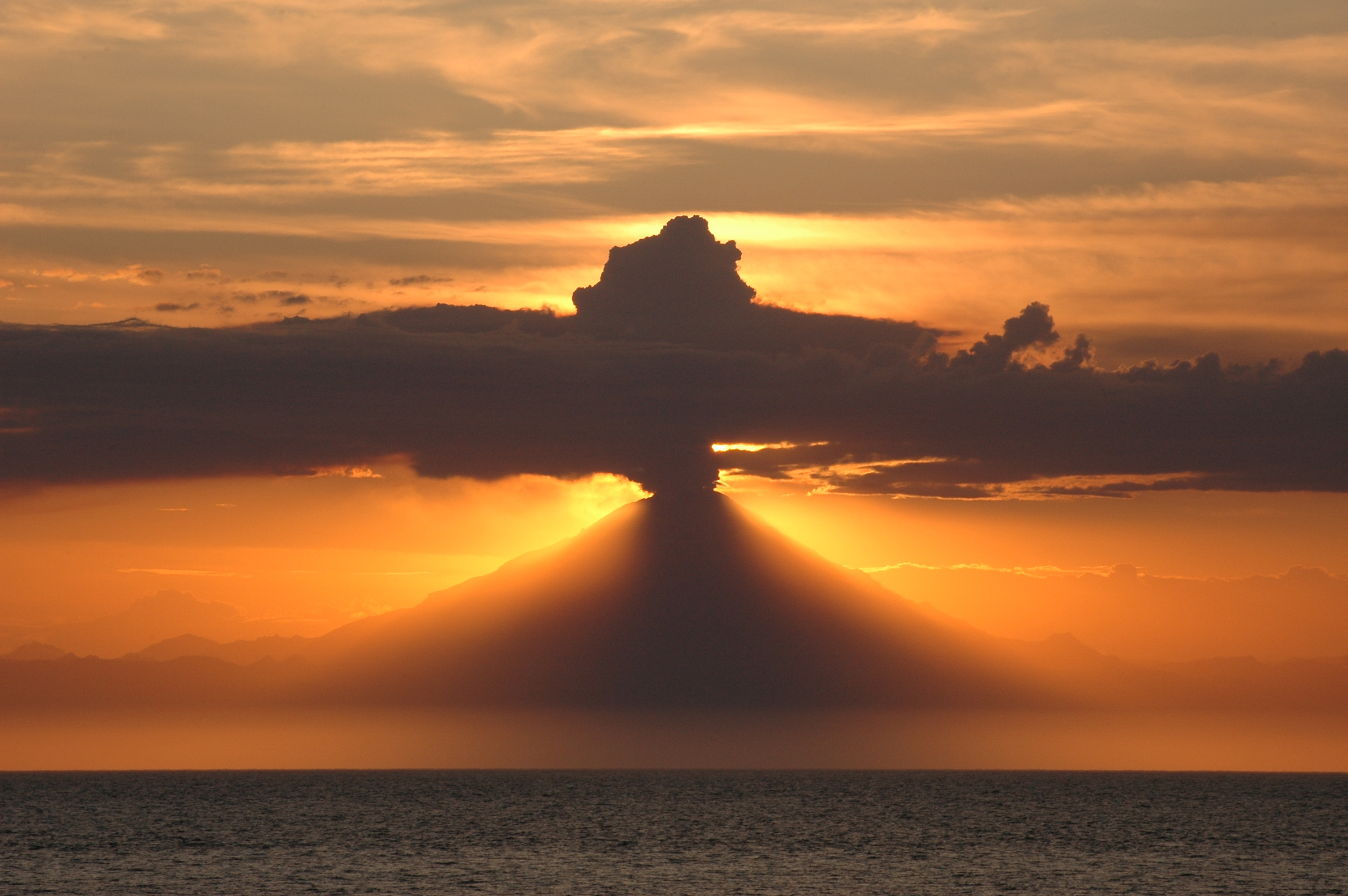 Photograph of Redoubt volcano steaming at sunset, taken from the Deep ...