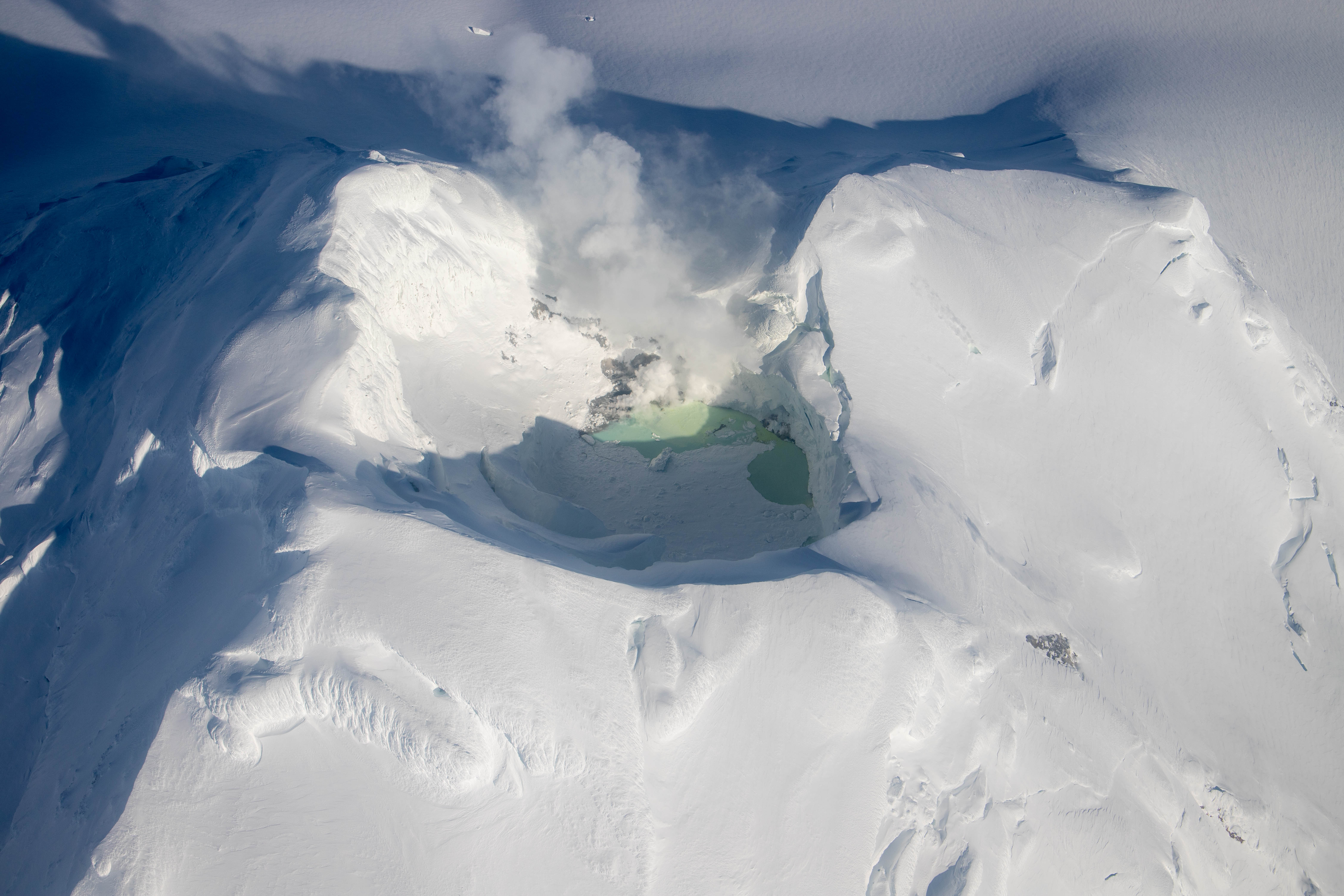 Lake inside of the Mount Spurr summit crater with fumaroles and ...