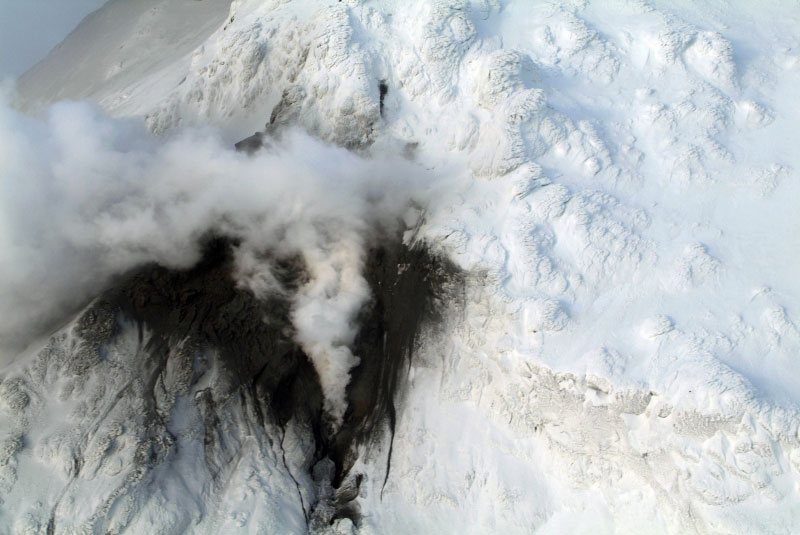 Steam jet on south east flank of Augustine volcano. Darkened area is ...