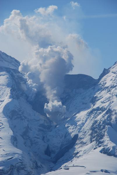 Rising rockfall-plume, seen from Redoubt's Hut. Heli-supported ...