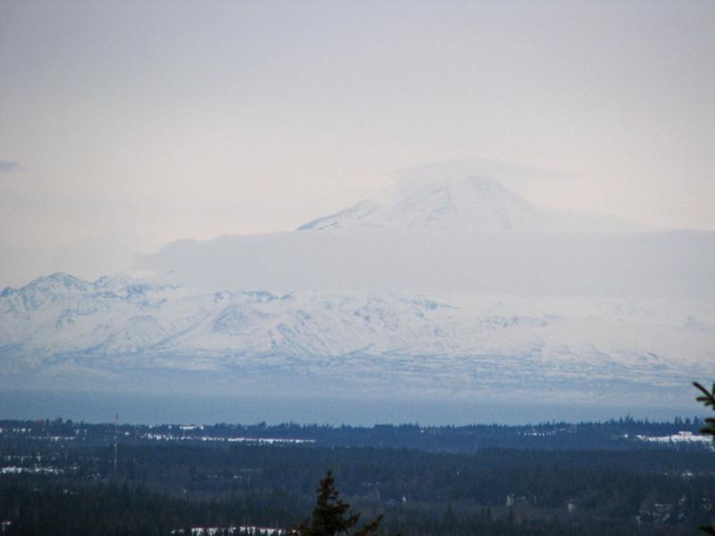 View of steaming and snow-covered Redoubt volcano on December 28, 2009 ...