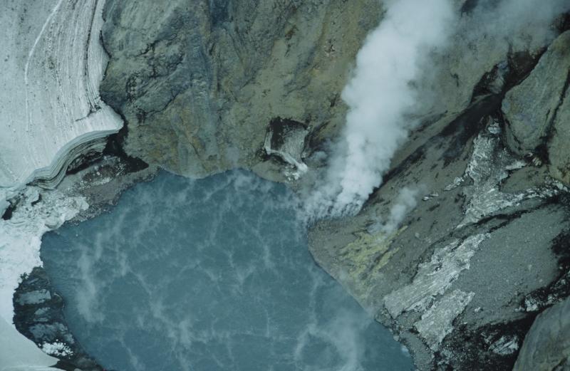 Aerial view of the lake and fumarole field inside Crater Peak vent of ...