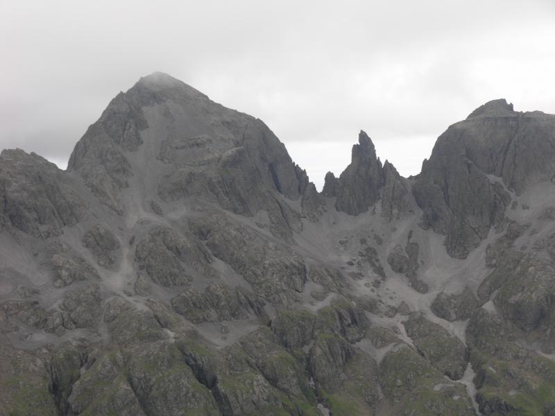 Ash from the 2008 eruption of Okmok volcano, coating the snow on the ...