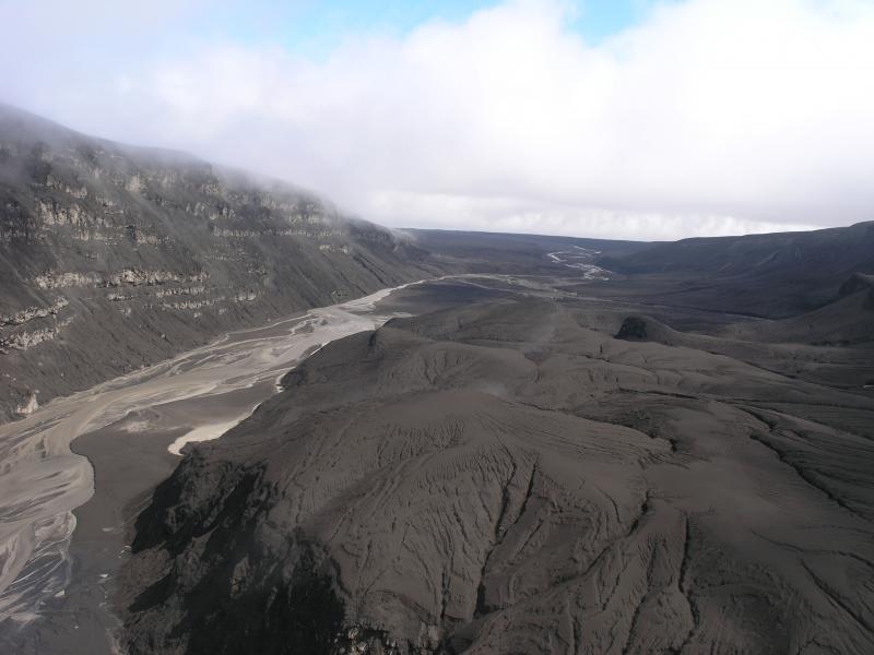 Ash blanketing the flanks of Okmok volcano. View is to the northeast ...