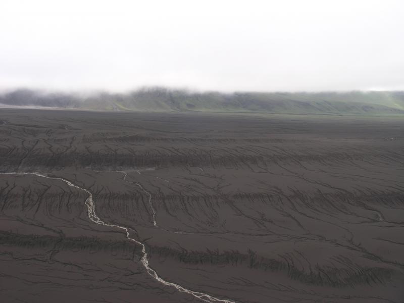 Ash blanketing the lower flanks of Okmok volcano during the 2008 eruption.