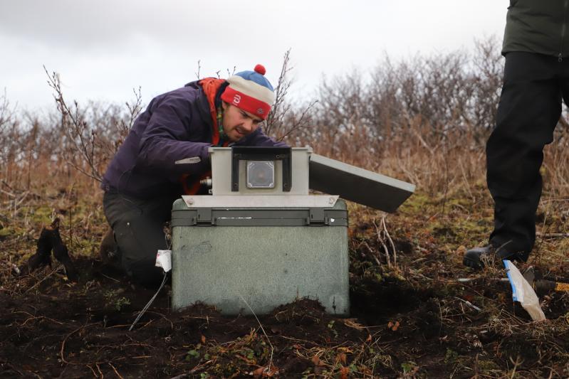 Wyatt Mayo (AVO/DGGS) installs a time-lapse camera on the north flank ...