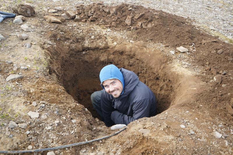 Wyatt Mayo installs a seismometer at MREP station at Makushin volcano.