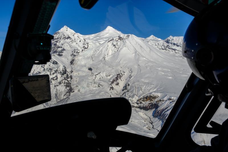 View from the cockpit during a helicopter gas and photo survey of Mount ...